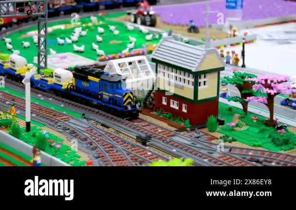 a city completely made of Lego blocks houses cars streets trains trams ...