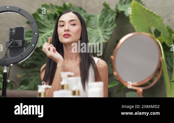 Beautiful content creator making natural beauty and cosmetic tutorial ...