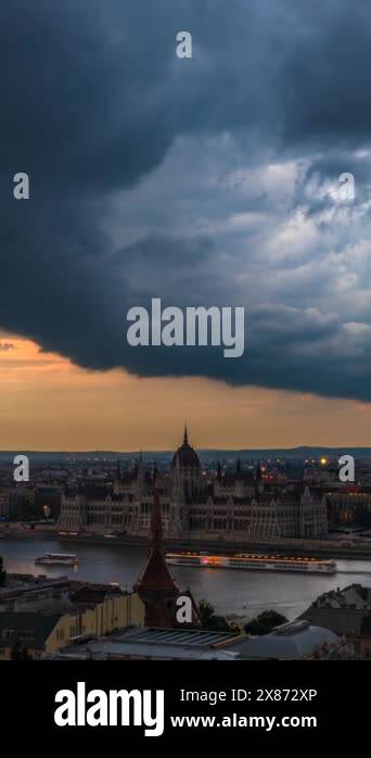 Thunderclouds on the Budapest Parliament whose lights are lit in the ...
