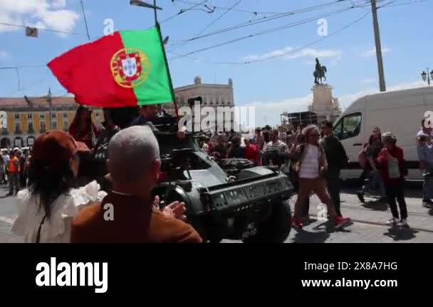 Crowd celebrating the passing of historic military vehicles from the ...