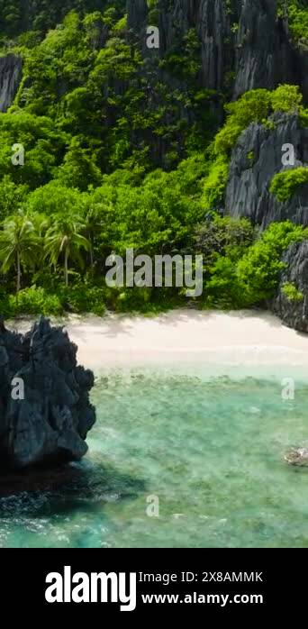 White Sand Beach with ocean waves. Matinloc Island. Beautiful Ocean ...