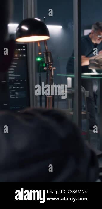 Two male automotive designers creating model of electric car in modern ...