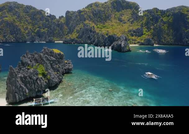4K Aerial view of strait between Shimizu and Miniloc Island in El Nido ...