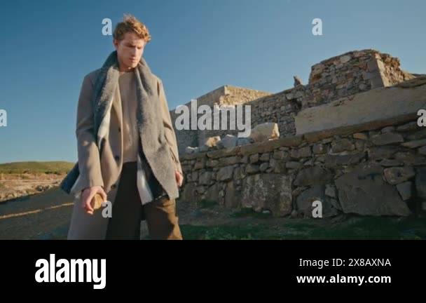 Angry man walking castle ruins place closeup. Nervous man looking ...
