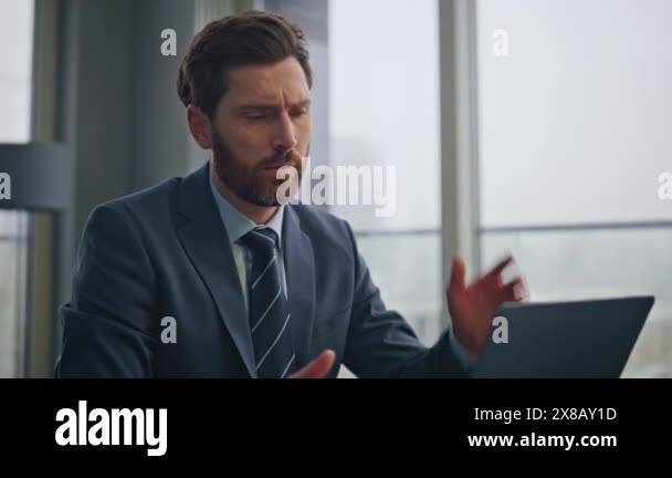 Frowning worker typing laptop busy of hard work closeup. Serious businessman feeling tired ...