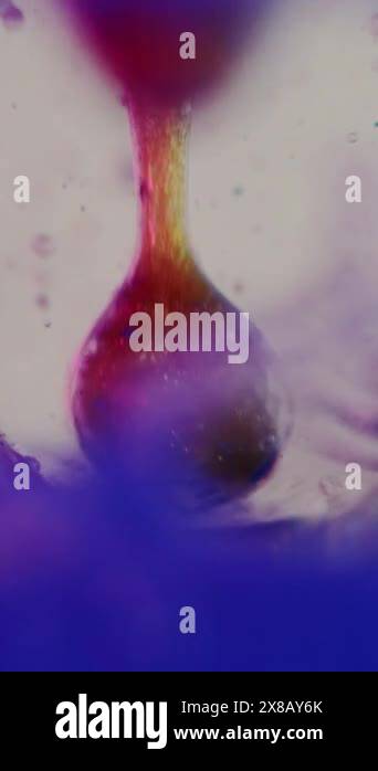 Vertical video. Color oil droplet. Foam splash. Jelly fluid texture ...