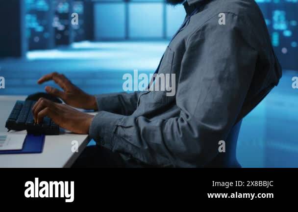 African american man working in server hub capable of processing vast ...