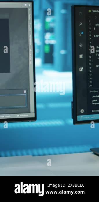 Vertical video Computers in empty data center facility managing rackmounts energy consumption ...