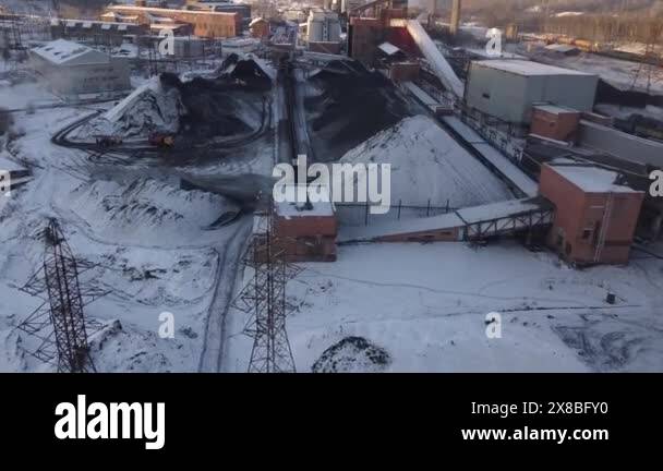 Drone video of a coal mine in a snowy setting, highlighting the urban ...