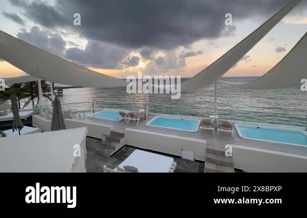 Incredible timelapse of a sunset from a balcony of a luxury resort in ...