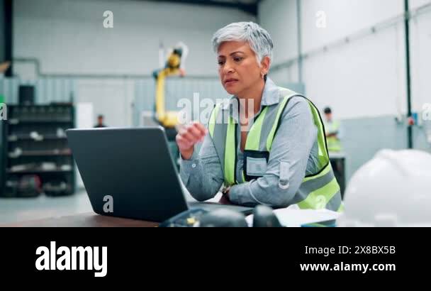 Mature, woman and factory worker with laptop, manufacturing business ...