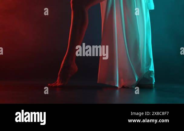 Contemporary dancer legs dancing barefoot on stage.Woman ballerina ...