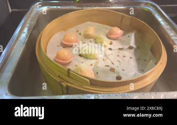 Steamed meat bun on hot steam pot, Hot steamed pork bun in bamboo ...
