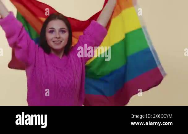 An adult protest woman showing multicolor LGBT flag, as symbol of ...