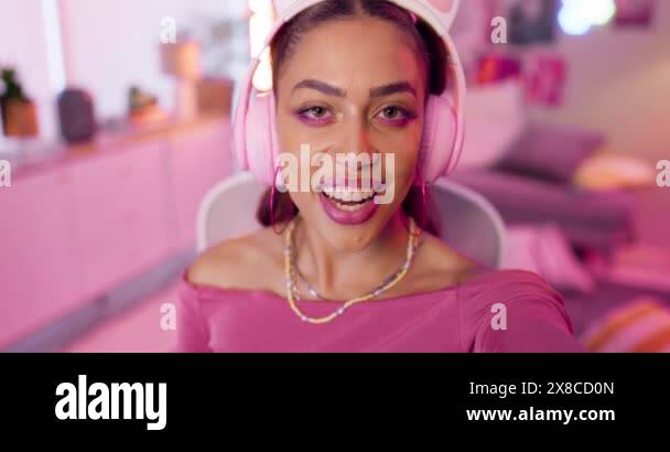 Face, headphones and video call of woman for live streaming, social ...