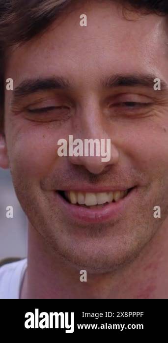 Vertical Close up face of happy young European man happy smiling on ...
