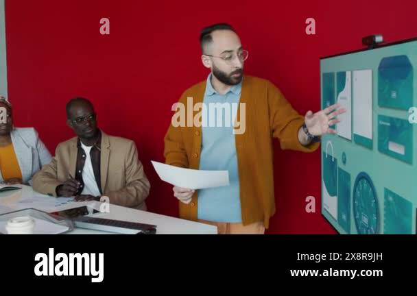 Medium shot of Middle Eastern product manager presenting new ...