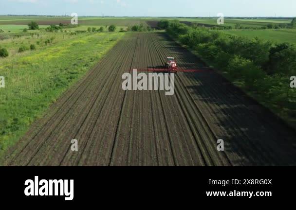 Above view, dolly move fly over, overhead tractor until spraying ... Above view, dolly move fly over, overhead tractor until spraying ...