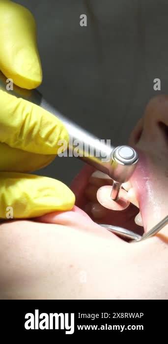 Dentists hands giving anesthetic injection to female patient during ...