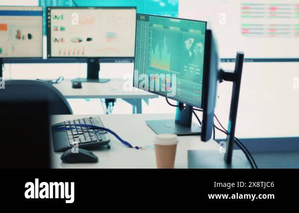 Empty telecommunications control room with workstations, coworking ...