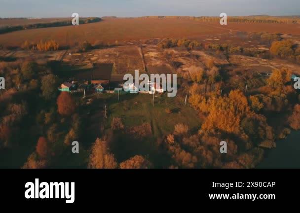 An aerial perspective of a quaint village during the autumn season ...
