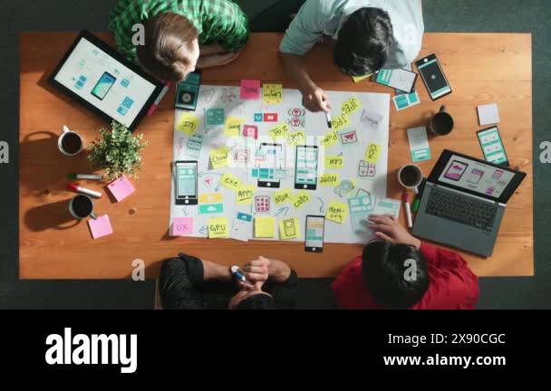 Professional developer team sharing idea of Ux Ui design by using mind map. Top down view of ...