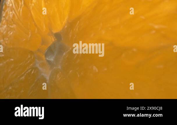 The macro photography of a sliced orange with vibrant orange color and ...
