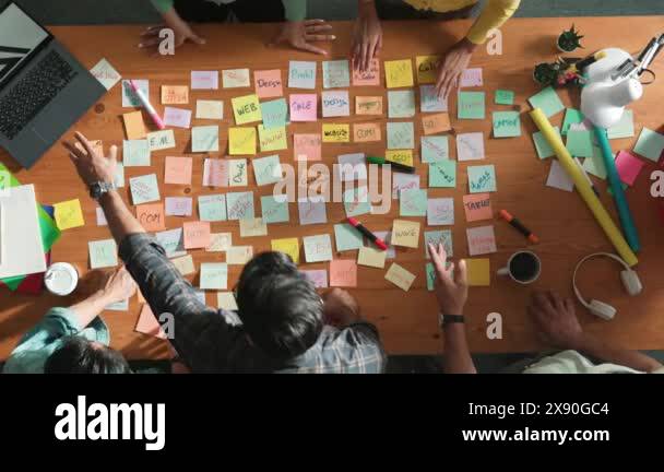 Top view of smart project manager talking and explain idea and clapping ...