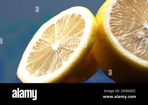 A slice of fresh lemon, bright yellow and vibrantly citric, lies ...