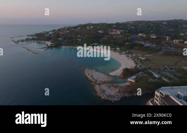 Aerial footage of the Jamaican coastline capturing the serene beaches ...