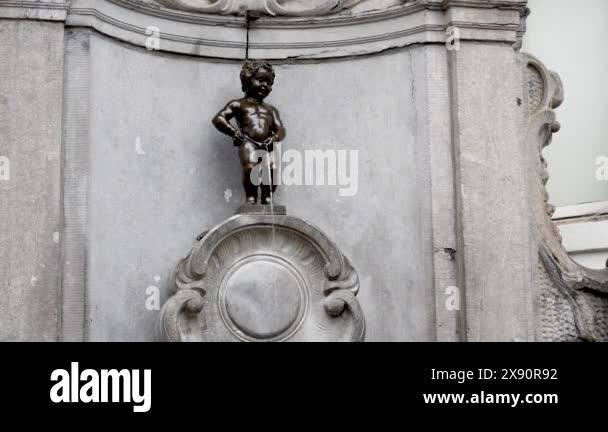 Manneken Pis, a renowned bronze sculpture and fountain in Brussels. The ...