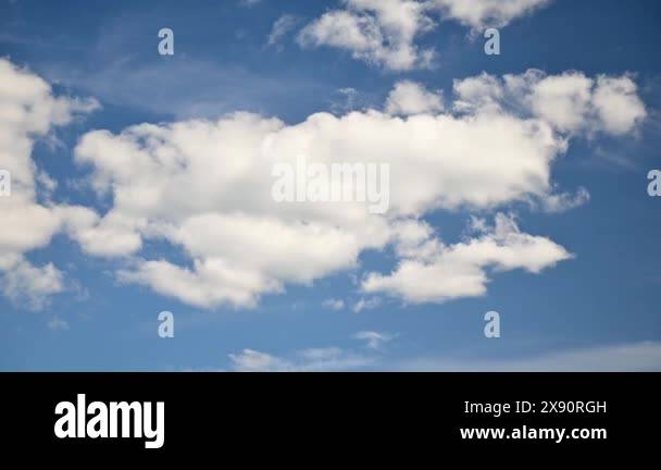 Overview of a beautiful blue sky in spring with fast moving clouds ...