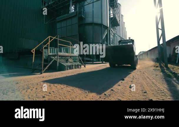 Loader Moving at Industrial Facility, A large loader is moving through ...