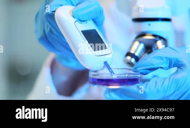 Using a digital tester to measure the specific gravity of a liquid ...