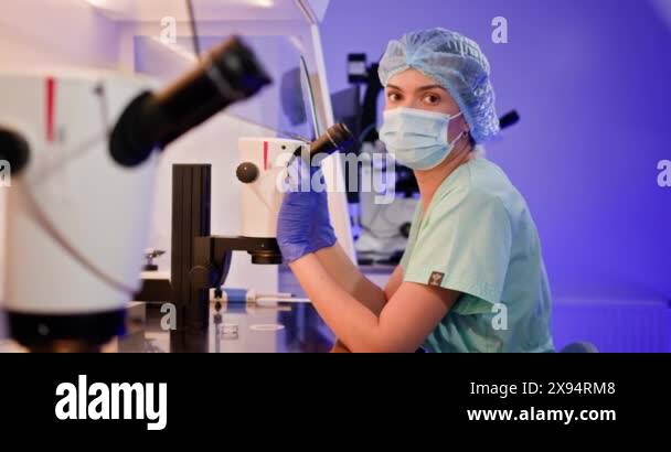 A dedicated embryologist performing artificial fertilization of a human ...