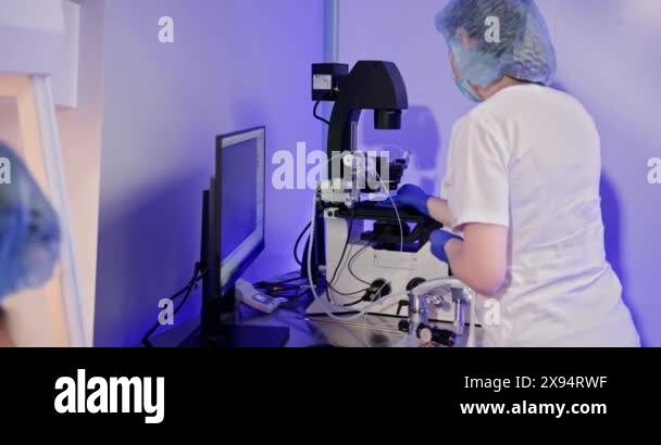 Female team studying DNA mutations. Wearing protective workwear. Female ...