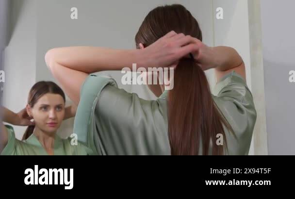 Tying hair up Stock Videos & Footage - HD and 4K Video Clips - Alamy