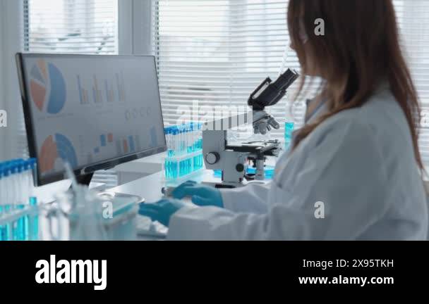 A pharmaceutical scientist in a laboratory where new drugs are ...