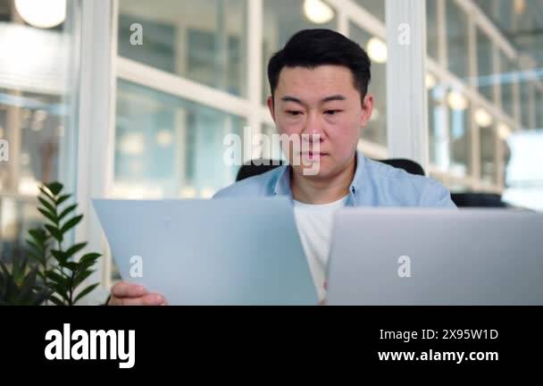Friendly legal firm employee looking up at camera and smiling after ...