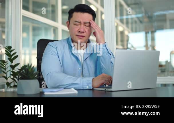 Unhealthy man grabbing hurting head with hand and closing eyes for ...