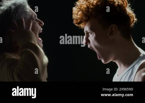 Split screen of two studio portraits of ginger haired young man ...