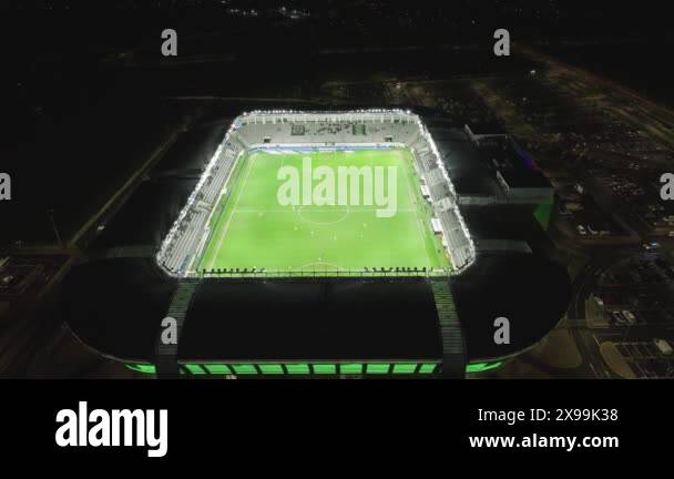 Night filming of the football stadium from a drone. Limassol Stadium ...