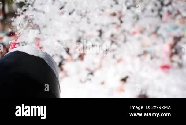Foam installation for foam party. Foam party on beach blowing from ...