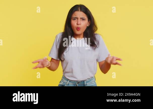 What. Why. Angry Indian woman raising hands in indignant expression ...