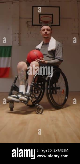 Vertical dolly-in portrait of tattooed young Caucasian man in ...