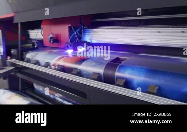 Large format printer printing on a roll of paper at high speed Stock ...