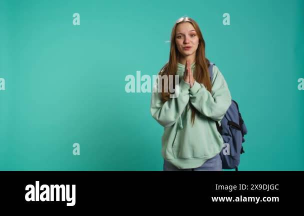 Woman doing begging hand gesture, in ardent need of favor from friend ...