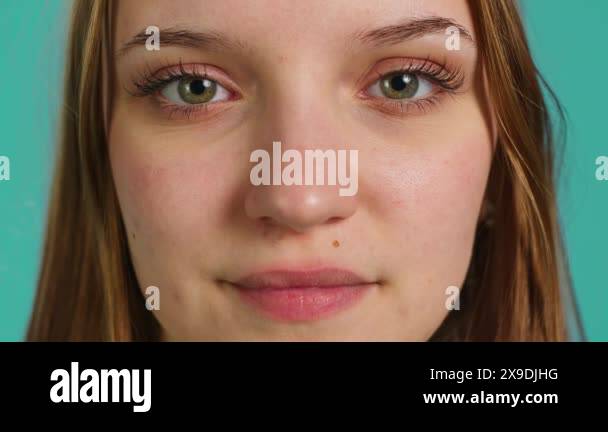 Extreme close up shot of elated joyful girl smiling, having fun ...