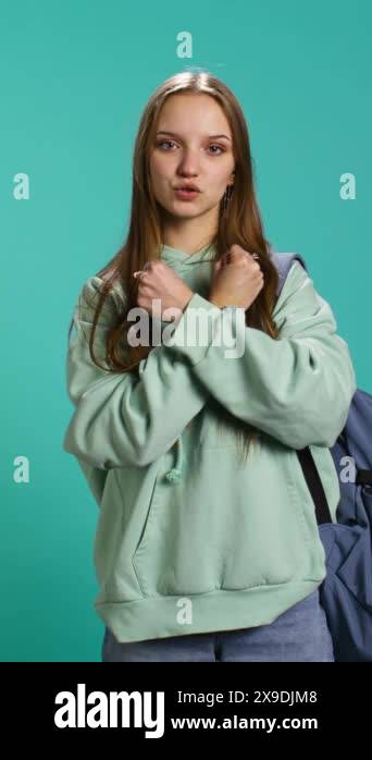 Vertical video Assertive woman shows letter X with arms crossed ...