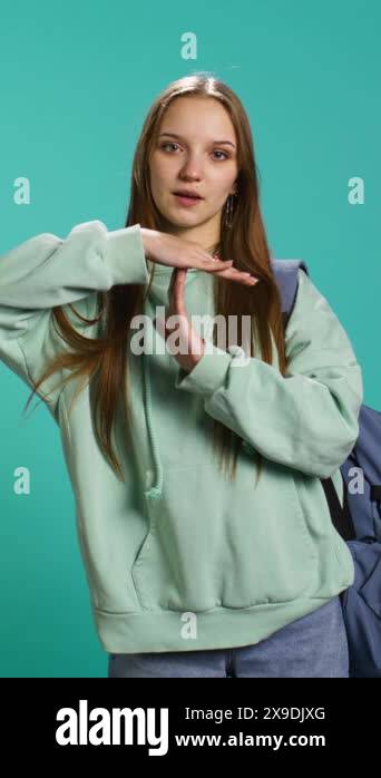 Vertical video Portrait of assertive woman asking for timeout, doing ...